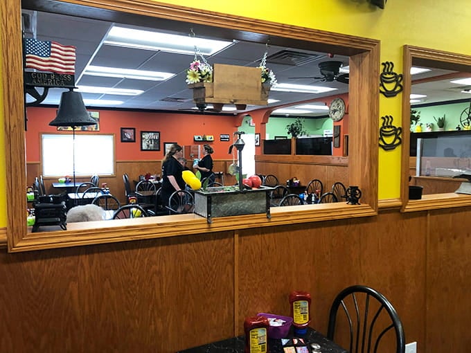 Those cheerful mirrors let you watch the breakfast magic happen while you wait for your own plate of glory.