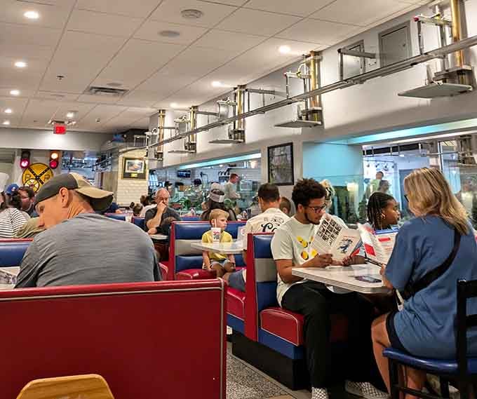 Diners of all ages share the experience, proving that train-delivered food transcends generational divides and dietary preferences alike.