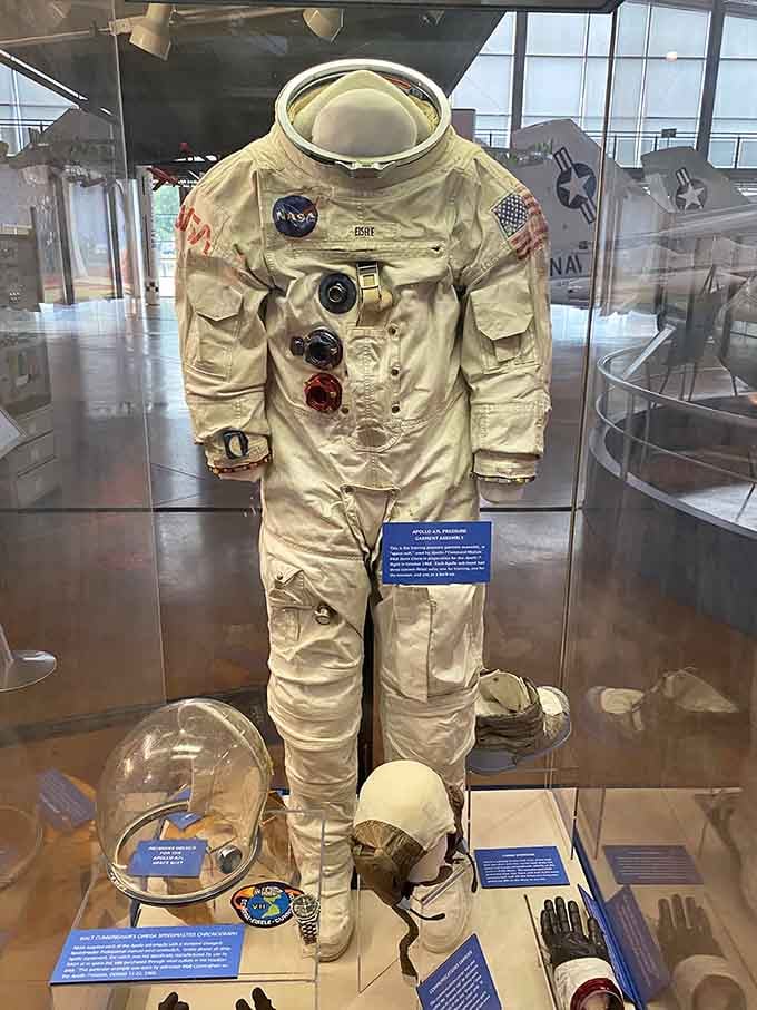 An authentic space suit stands ready, looking surprisingly compact for protecting humans in the void.