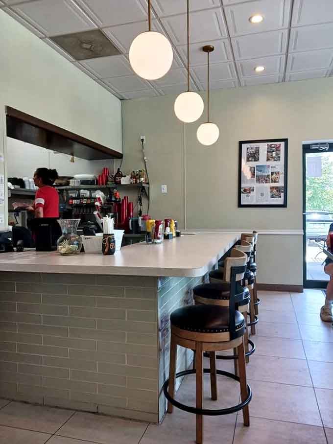 Globe pendant lights and subway tile create a clean, inviting space where the food takes center stage.