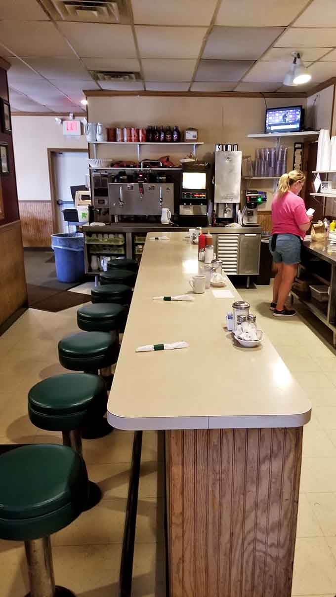 The classic diner counter where locals gather, swap stories, and solve the world's problems over endless coffee refills.