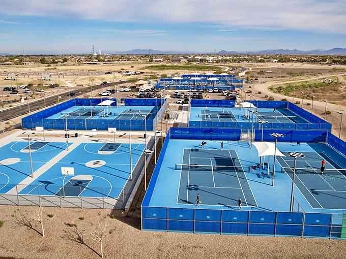Bright blue courts for tennis and pickleball enthusiasts who want to pretend they're still athletic and spry.