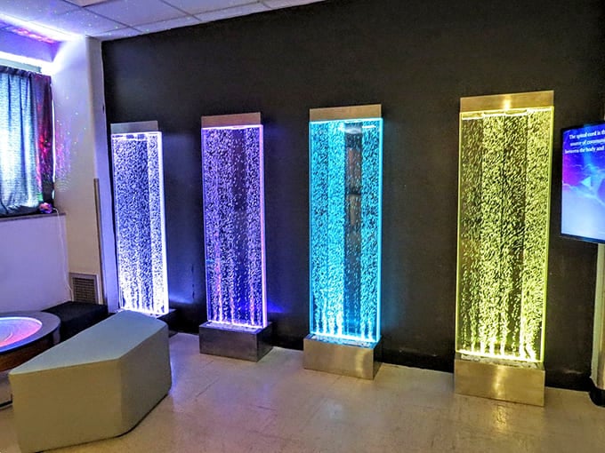 These illuminated bubble walls represent modern sensory healing approaches, a stark contrast to the museum's historical treatment displays.