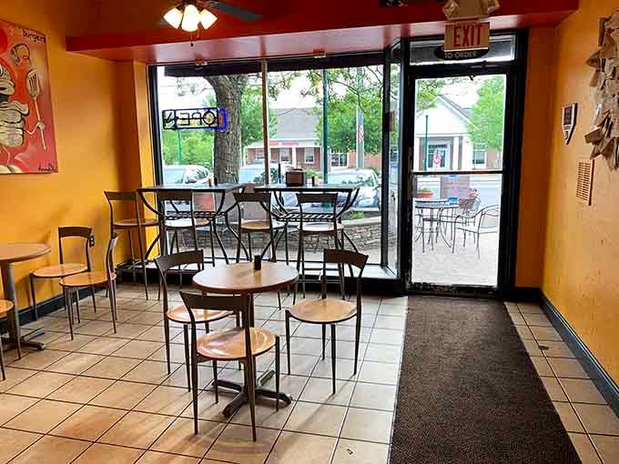 That exit sign and those tables by the window suggest this place gets busy enough that traffic flow actually matters during lunch rush.