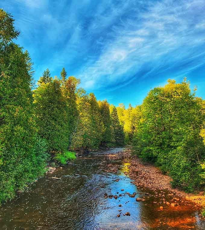 Autumn paints the riverside trail in colors that make you wonder why anyone bothers with interior decorators.