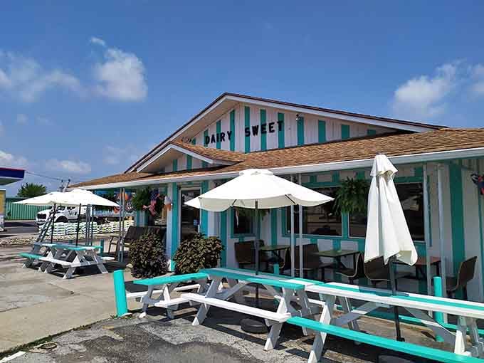 Dairy Sweet's turquoise trim and picnic tables promise simple pleasures: soft serve, sunshine, and zero pretension required.