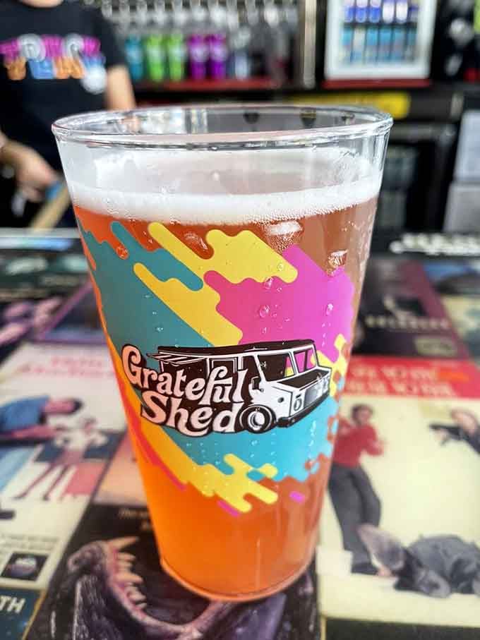 Local craft beer in a colorful Grateful Shed cup adds the perfect refreshment to your meal.