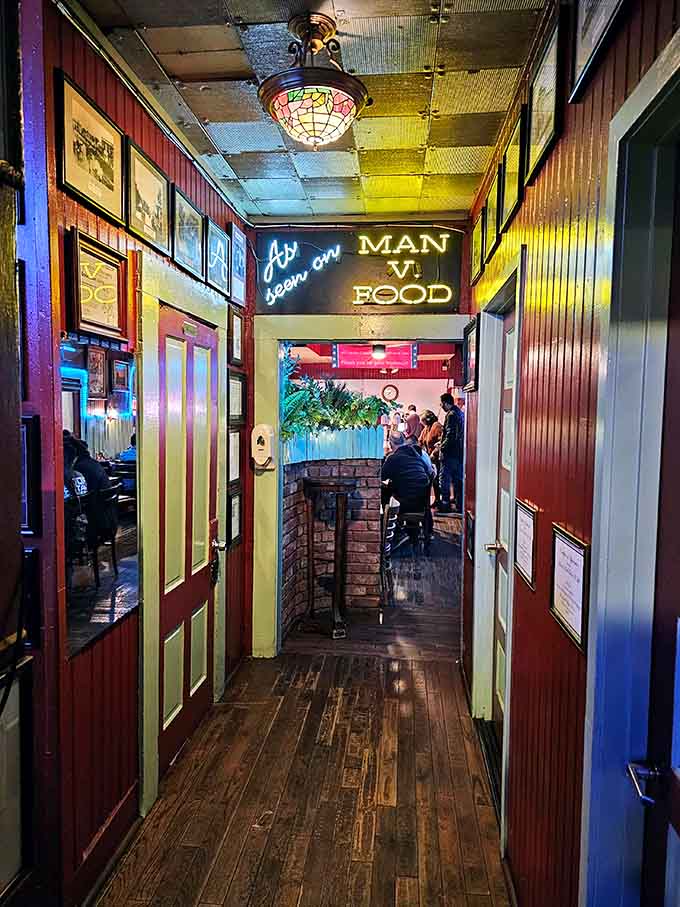 That hallway sign says it all: "As seen on MAN V. FOOD," which is basically a Michelin star for real people.