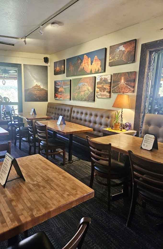 Tufted banquettes and red rock photography create an atmosphere where comfort food meets comfortable surroundings perfectly.