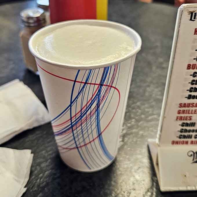 That classic paper cup holds your beverage of choice, keeping things refreshingly uncomplicated since forever.