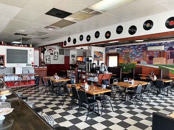 Vinyl records line the walls while classic diner tables await their next hungry patrons. The 50s vibe isn't manufactured &ndash; it's marinated in decades of service.