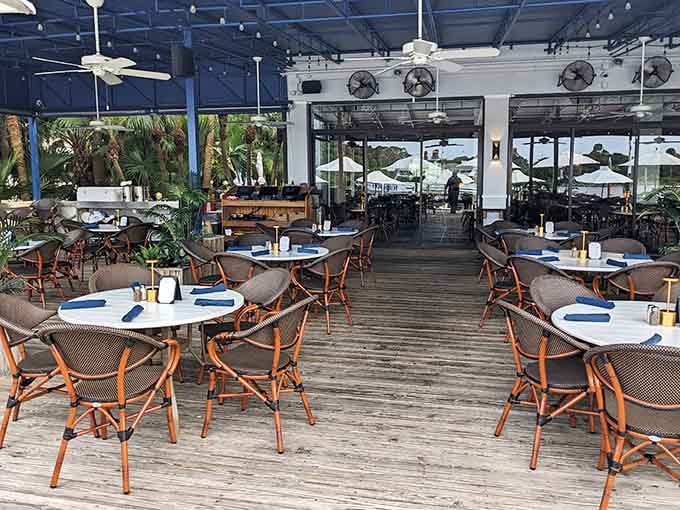 Outdoor deck seating where ceiling fans keep you cool and the Intracoastal provides endless entertainment free.