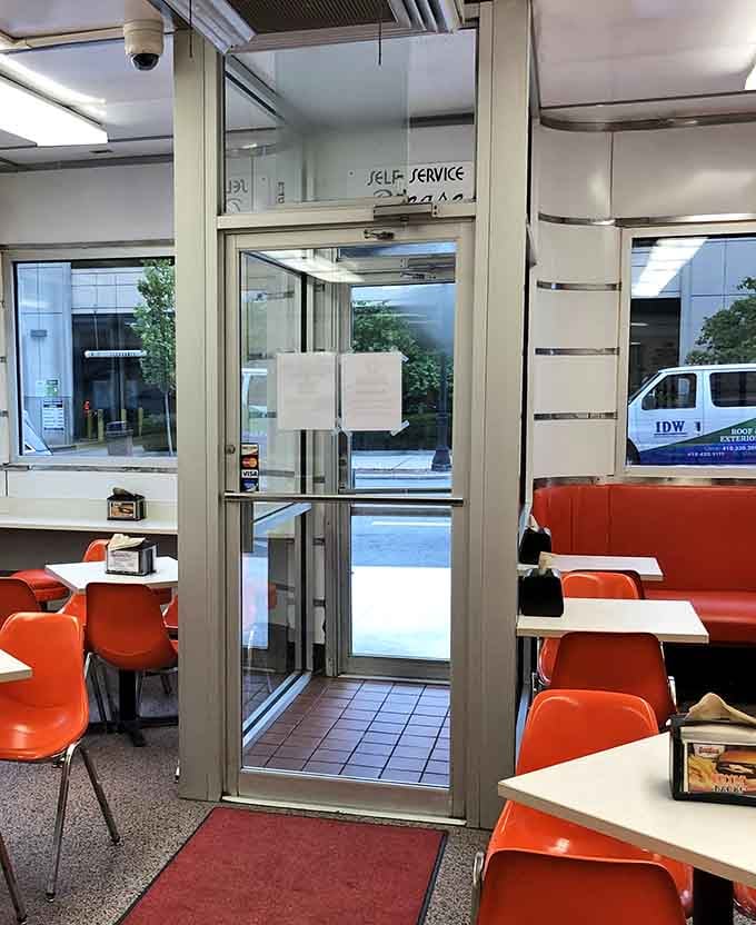 Self-service doors leading to burger bliss&mdash;your gateway to understanding what all the delicious fuss is truly about.