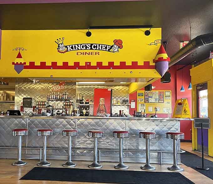 Chrome-topped stools line the counter where solo diners can watch the breakfast magic happen in real time.