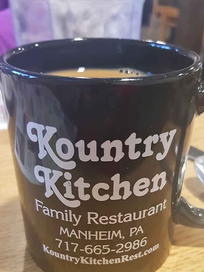 Coffee served in a mug bearing the restaurant's name, turning your morning caffeine into a souvenir-worthy experience you'll actually remember.