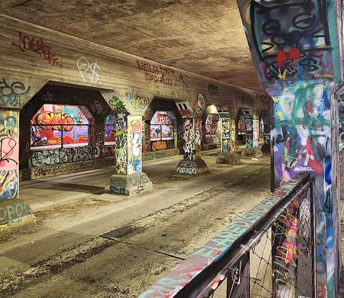 Looking down the tunnel's length reveals layers upon layers of artwork competing for attention in the best possible way.