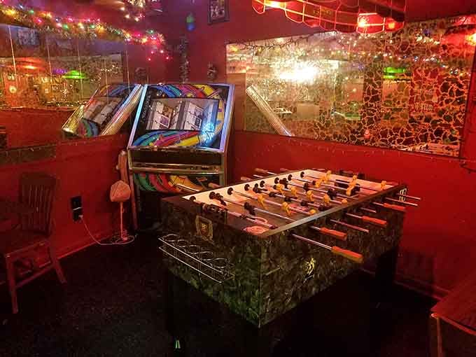 Foosball table surrounded by enough decorations to distract you from losing badly.