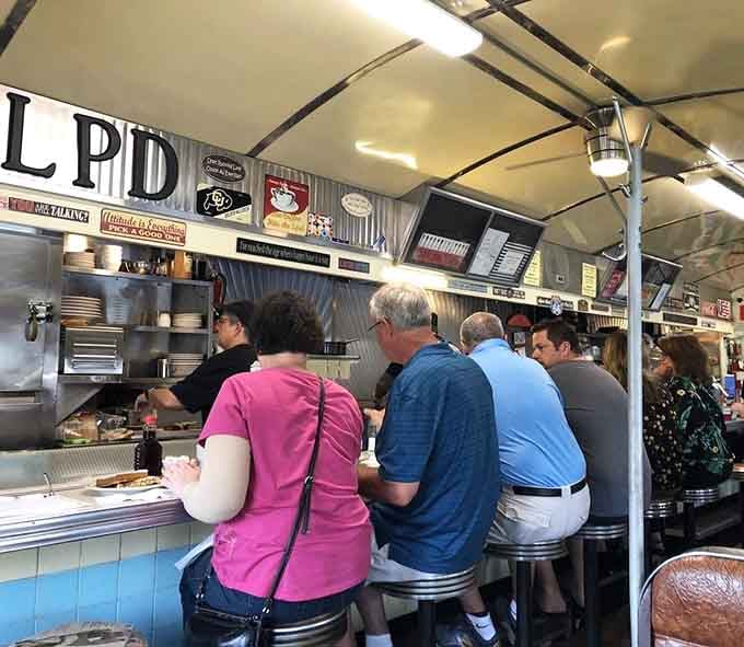 Counter seating where strangers become friends over eggs and the universal language of good food and better conversation.