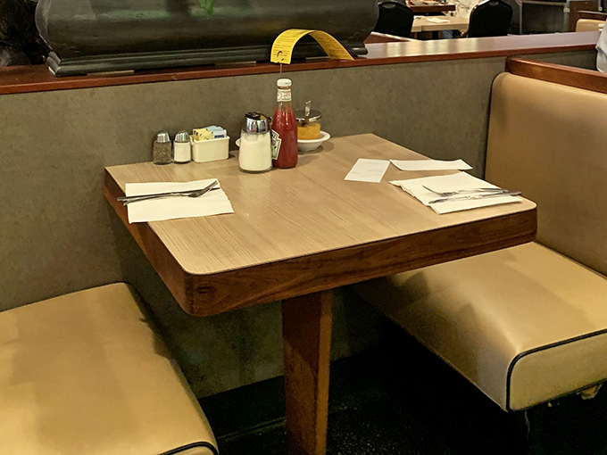 Table settings ready and waiting, complete with syrup and hot sauce, because breakfast is a choose-your-own-adventure situation here.