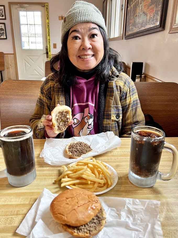 A happy customer knows exactly what she's gotten herself into, and that smile says it was worth every bite.