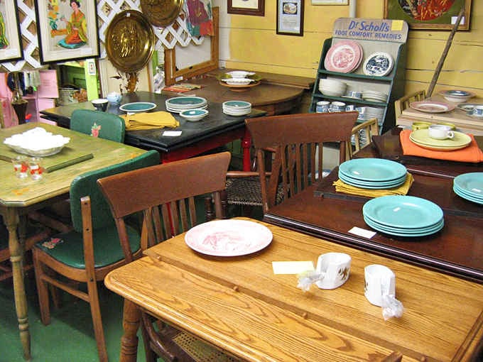 Mismatched dining tables and chairs proving that before IKEA, people actually built furniture meant to outlast their grandchildren's grandchildren.