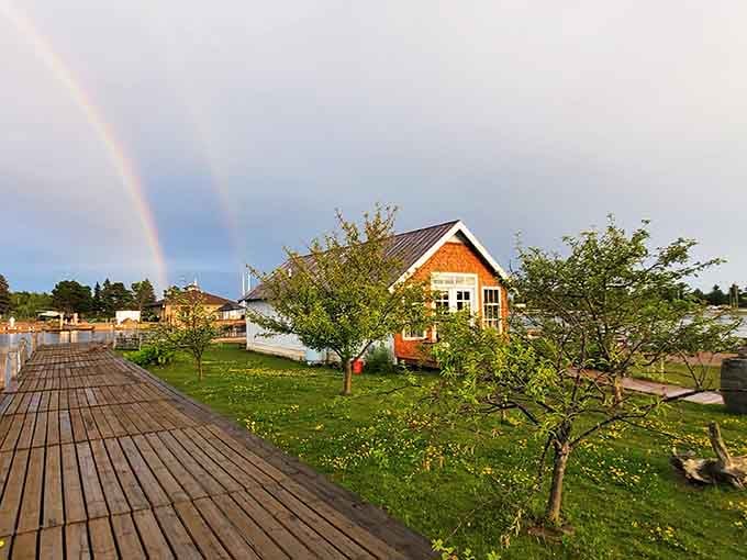 That rainbow over Mackinaw Trail Winery feels like the universe approving your decision to visit Manistique's harbor.