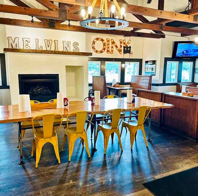 The "Melvin's Oink" sign and cozy fireplace create an atmosphere that's equal parts whimsical and welcoming for every guest.