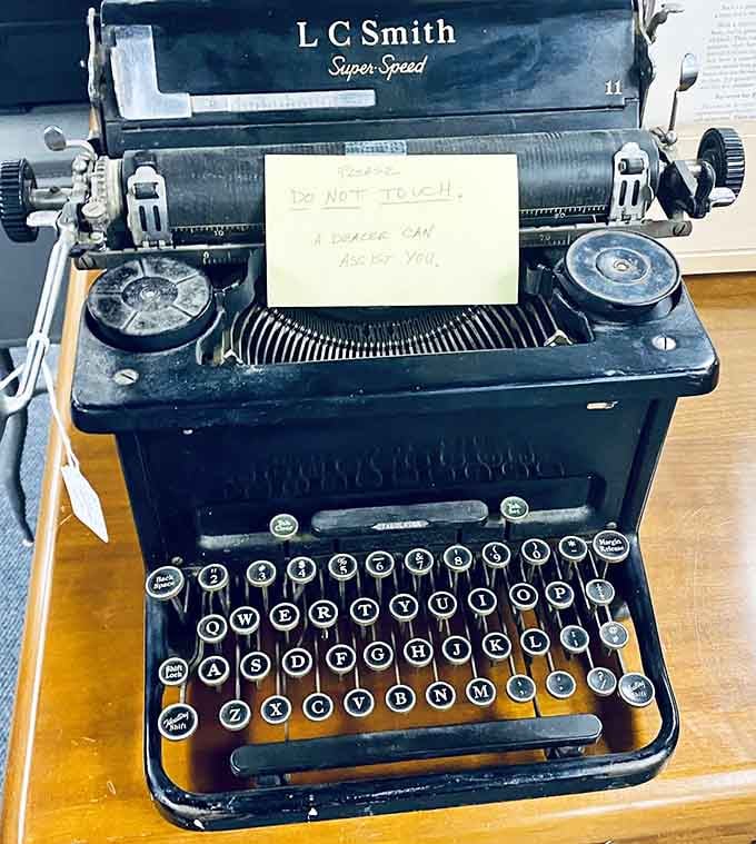 An L C Smith typewriter with attitude, complete with a warning that doubles as life advice.