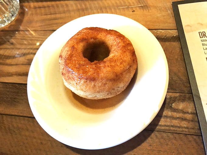 A cinnamon-dusted baked apple swimming in sauce, simple comfort food elevated to an art form.