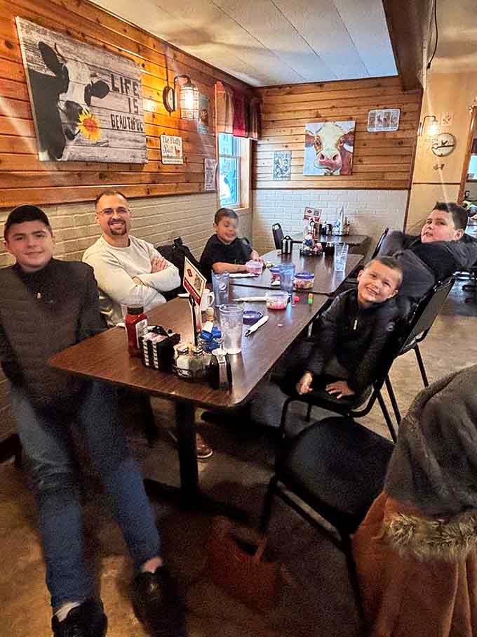 Multigenerational dining at its finest—families creating memories one breakfast plate at a time in this welcoming space.