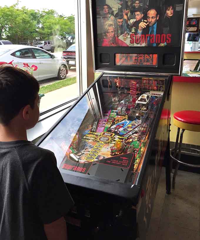 A Sopranos pinball machine adds unexpected entertainment between bites of your burger.