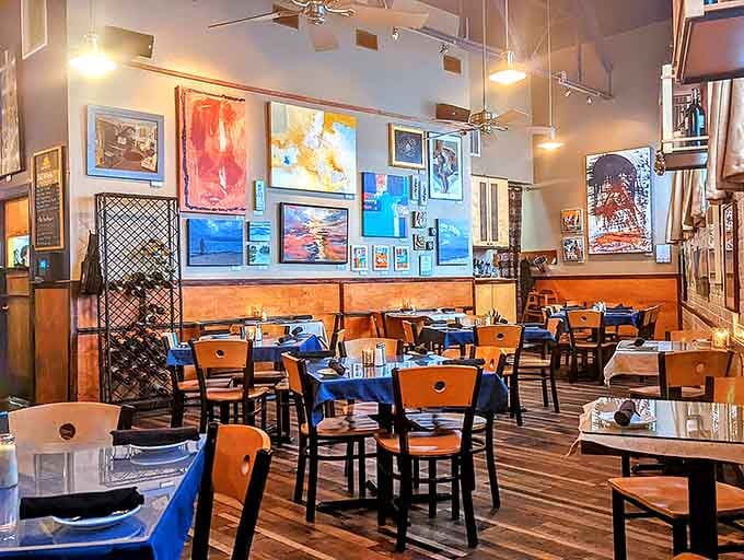 Colorful artwork adorning the walls adds personality and charm to every meal, making the space feel like home.