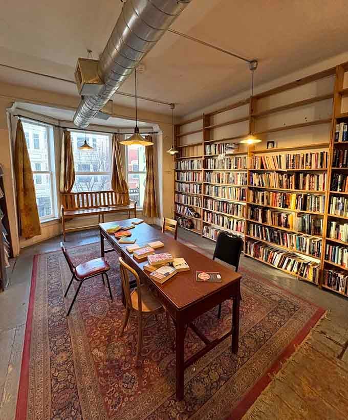 That reading table surrounded by books creates the kind of study space college students dream about finding.