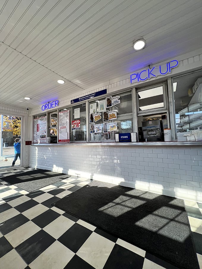 "ORDER" and "PICK UP" in neon blue&mdash;simple instructions for a transaction that delivers happiness wrapped in paper. No apps required.