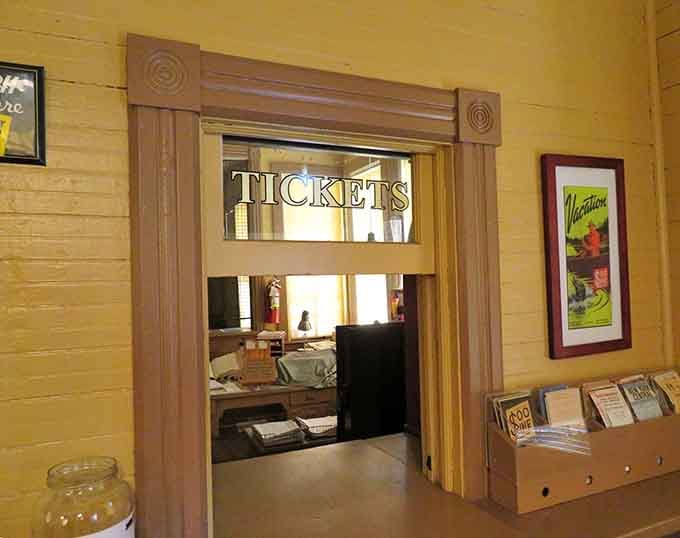 The classic ticket window beckons with wooden trim and vintage posters, back when buying passage felt like the start of an adventure.