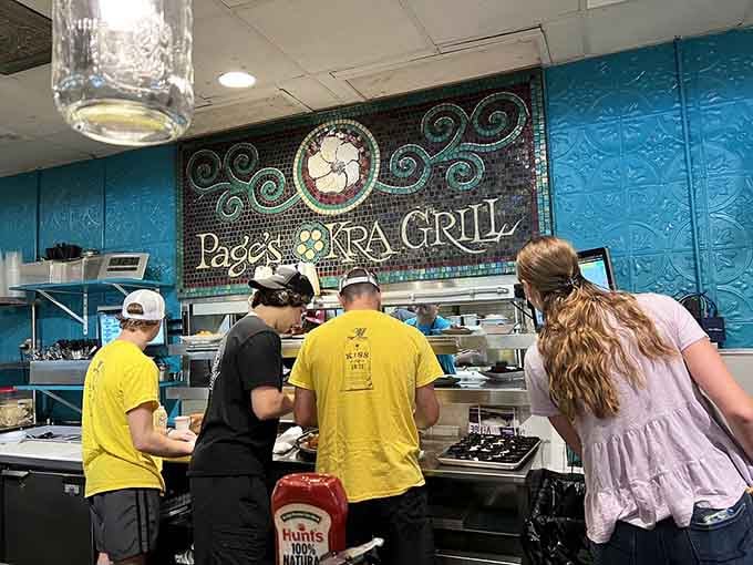 The friendly crew behind the counter working hard to keep those hungry customers smiling and well-fed all day.