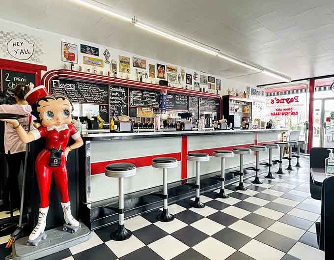 Betty Boop guards the counter where countless conversations have unfolded over sandwiches, shakes, and genuine human connection.
