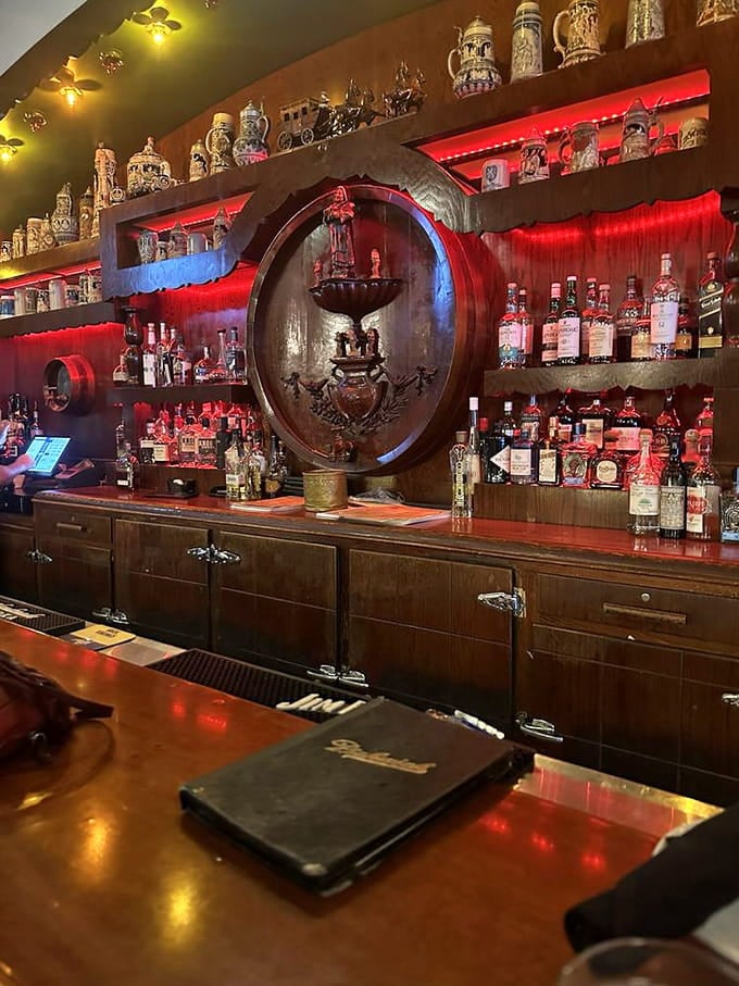 That impressive barrel centerpiece surrounded by spirits creates a bar backdrop worthy of your favorite classic film scene.
