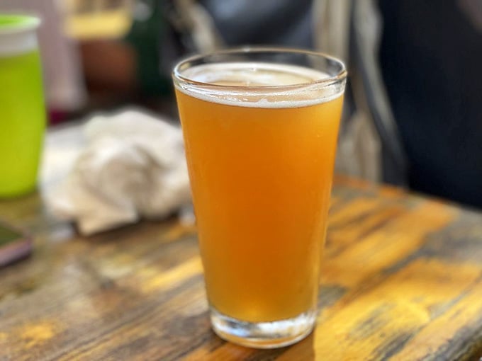 Cold craft beer in a simple glass is sometimes all you need to complement a perfect burger.