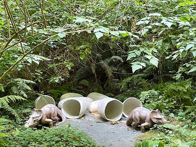Baby triceratops emerging from eggs: nature's original surprise party, frozen in concrete and pure joy.