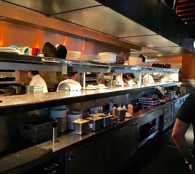 An open kitchen means you can watch the magic happen while your anticipation builds deliciously.