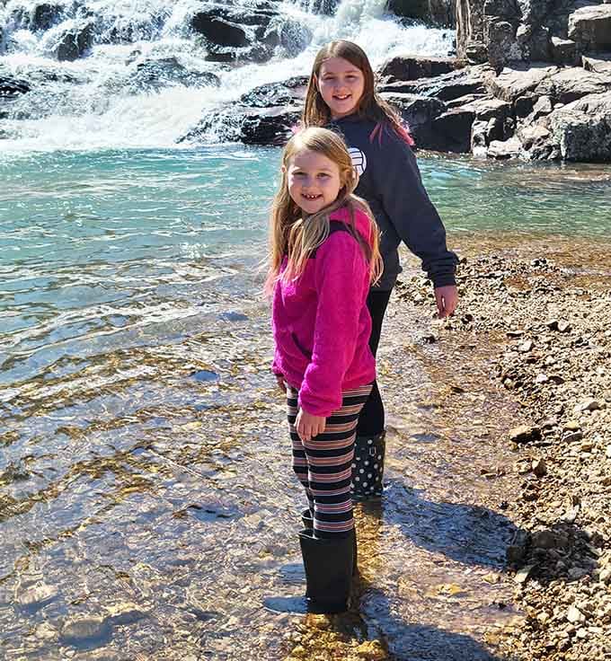 Young explorers discover the joy of wading where ancient rock meets refreshingly cold Ozark spring water.