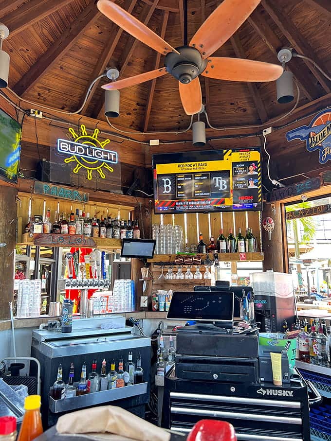 The bar beckons with cold drinks and warm hospitality, where shuckers perform their craft like seasoned artists.