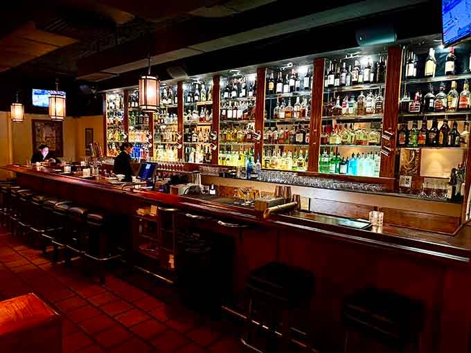 That well-stocked bar gleams with promise, ready to craft whatever cocktail your seafood-loving heart desires tonight.