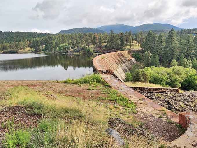 Santa Fe Dam creates a serene reservoir where forest meets water. Engineering and nature finding rare harmony in the Arizona highlands.