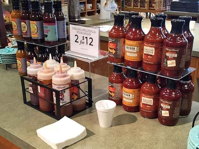 BBQ sauce battalion standing ready for duty, with squeeze bottles nearby for the inevitable taste-testing that follows the "2 for $12" sign.