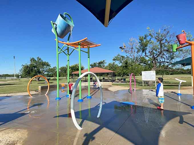 Scarborough Park's splash pad keeps kids entertained during hot Texas summers without expensive water park admission fees.