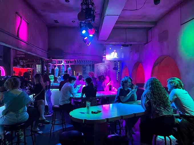 The crowd's energy matches the decor; everyone's here to escape reality and embrace their inner space adventurer together.