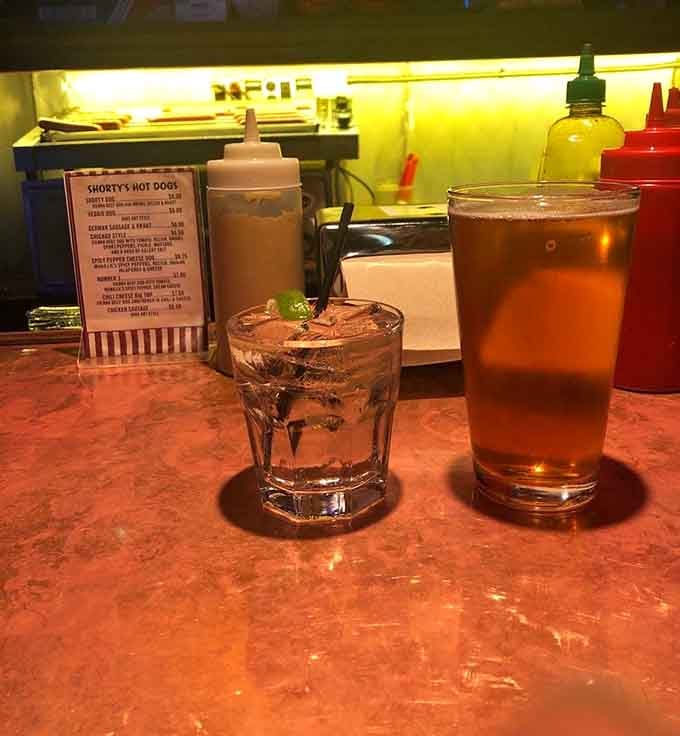 Cold drinks waiting patiently while pinball machines call your name, the perfect fuel for an evening of arcade glory.