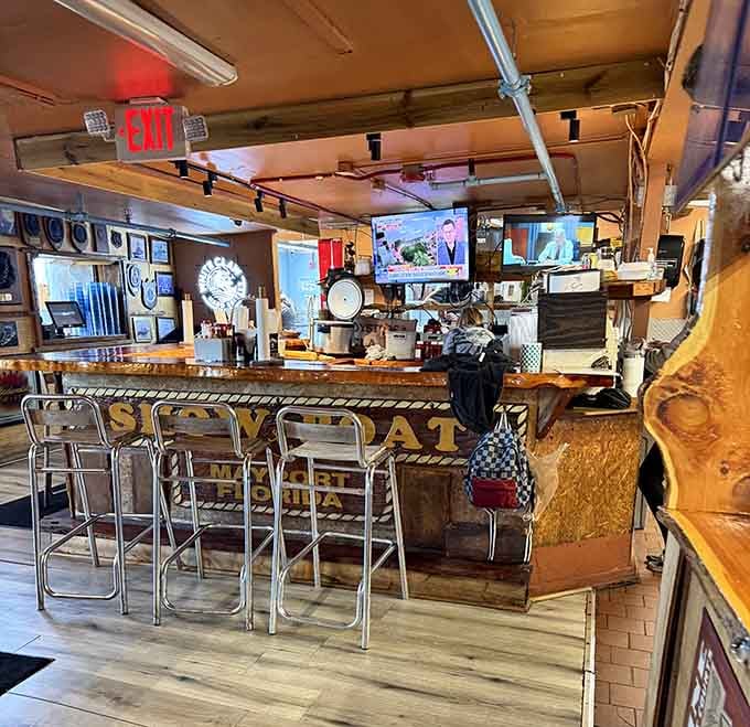The bar area where cold drinks and warm hospitality come together under vintage beer signs.